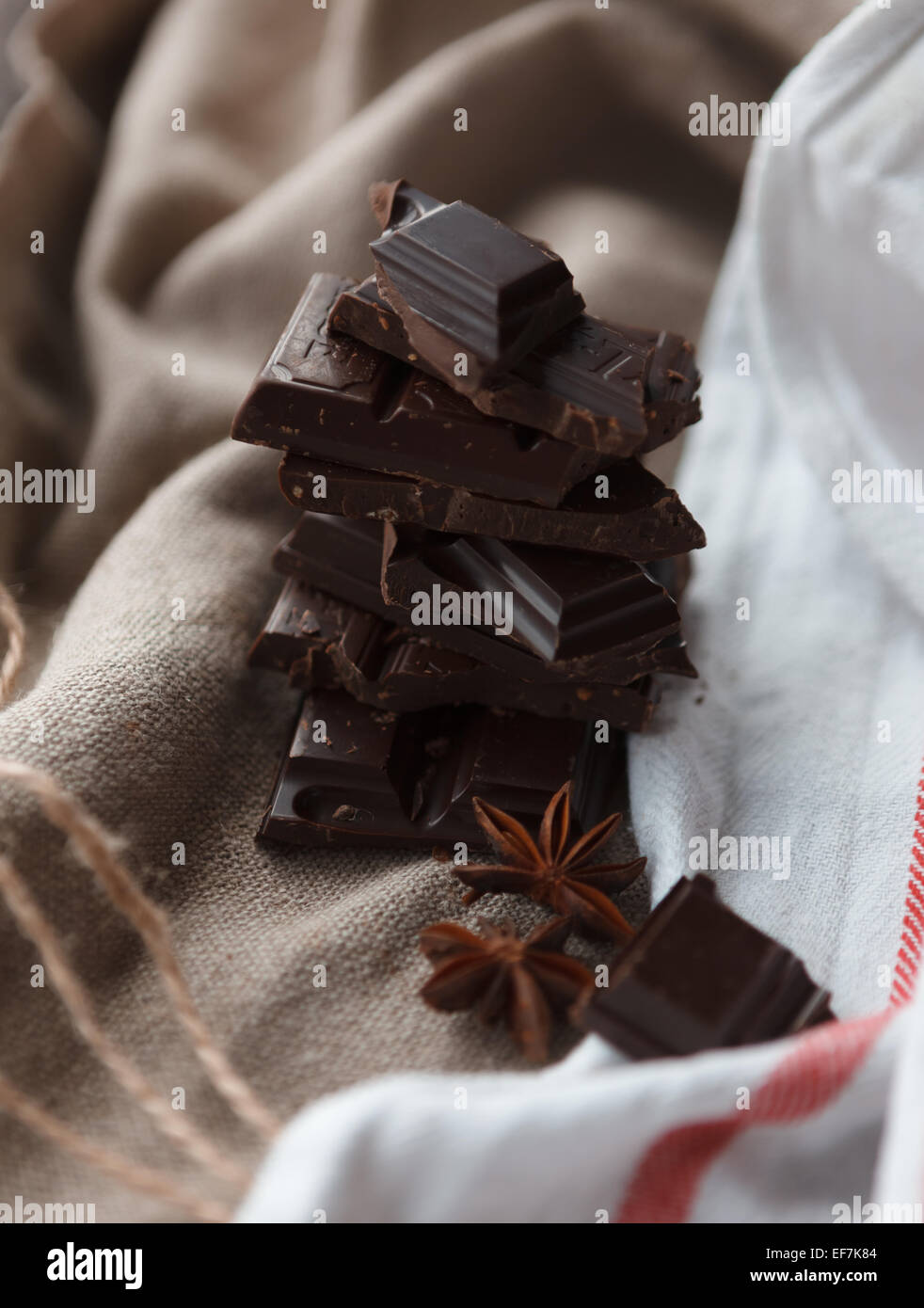 Broken chocolate bar and stars anise Stock Photo - Alamy