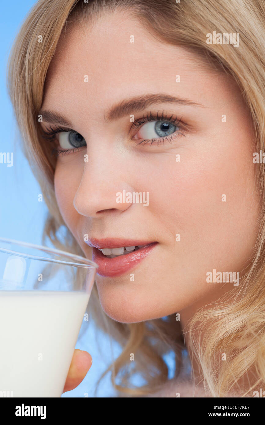 Close-up of a woman drinking milk Stock Photo - Alamy