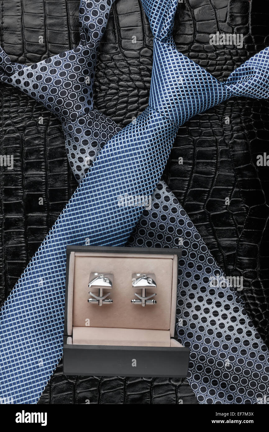 Two necktie and cufflinks lying on the skin, can be used as background ...