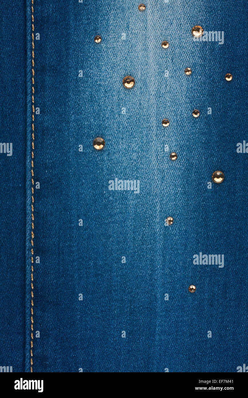 Yellow seam and yellow rhinestones on denim, background, texture Stock ...