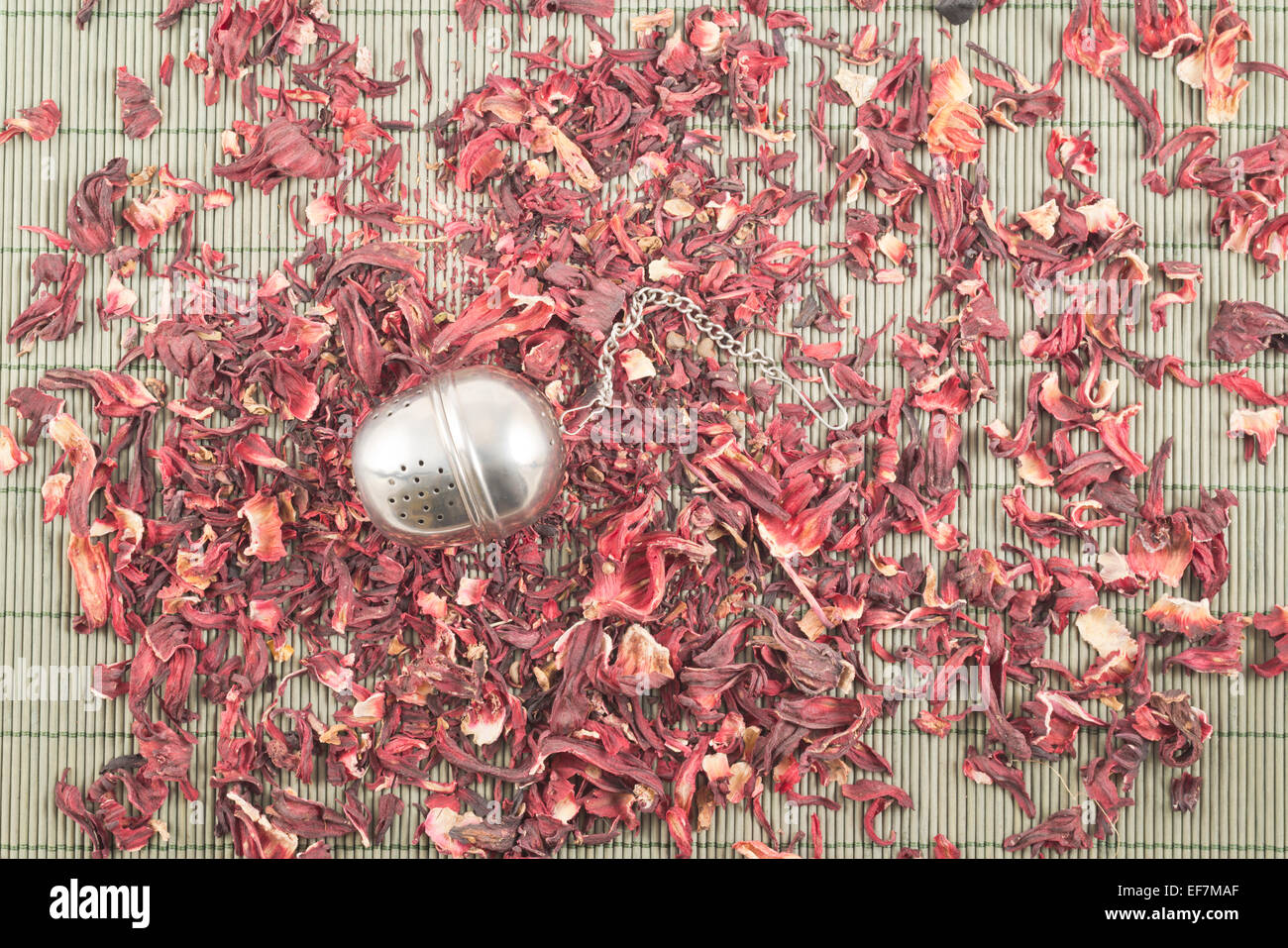 Tea infuser over red tea Stock Photo - Alamy