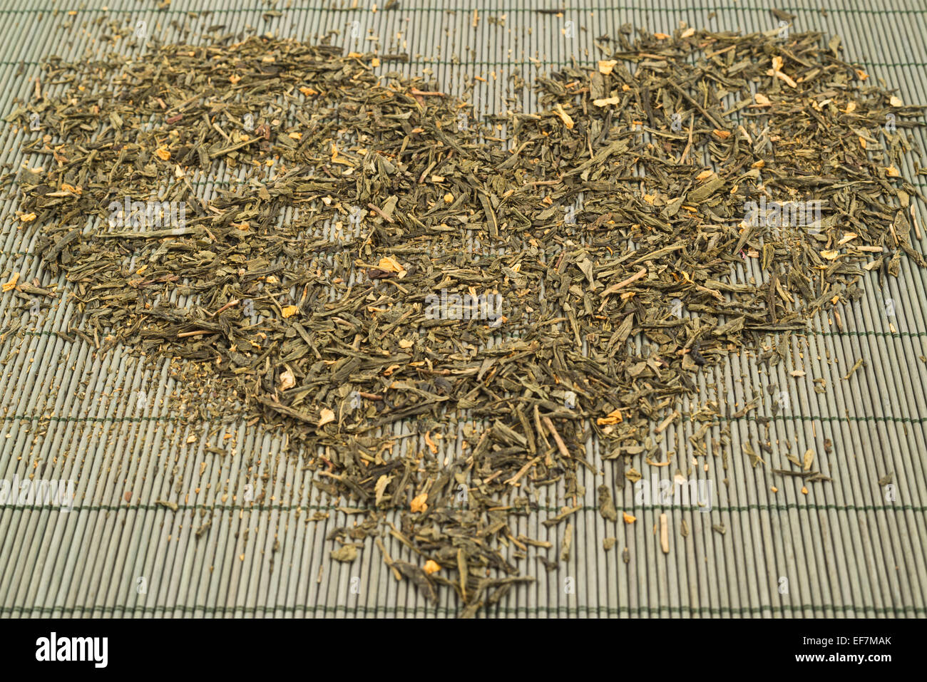Green tea heart shape sideview Stock Photo - Alamy