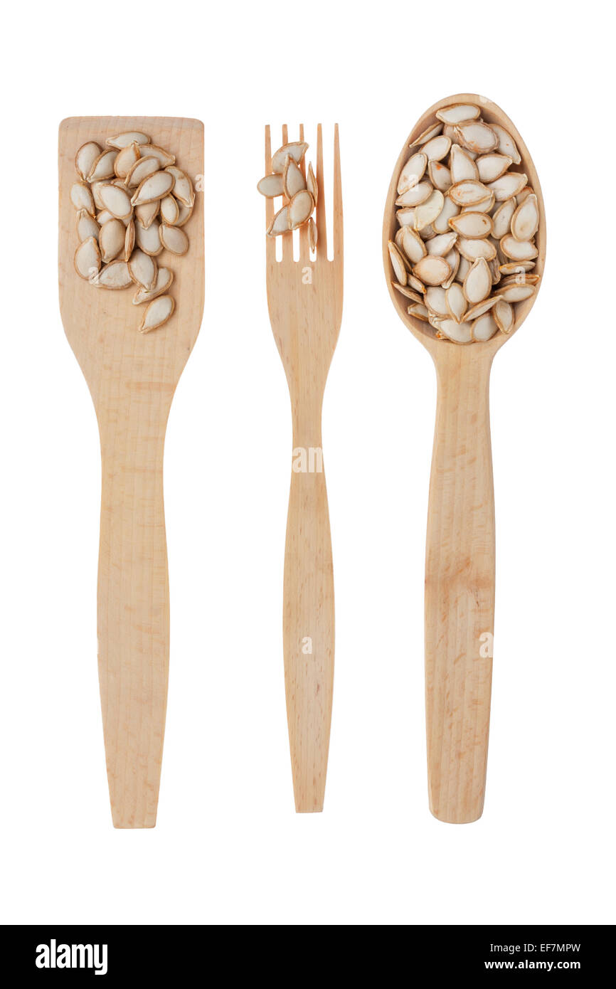 Wooden spoon, fork, paddle with pumpkin seed, isolated on white ...