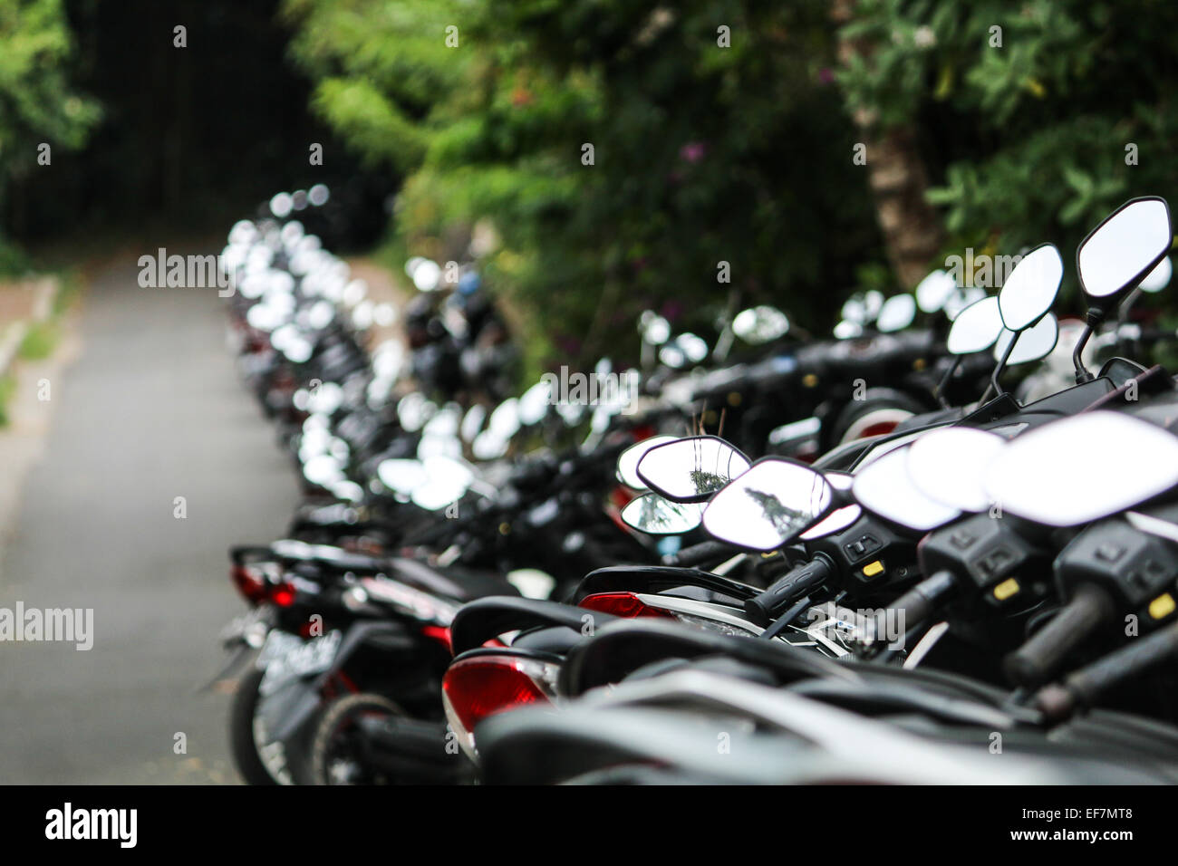 A mass of mopeds parked along a street in Bali Stock Photo - Alamy