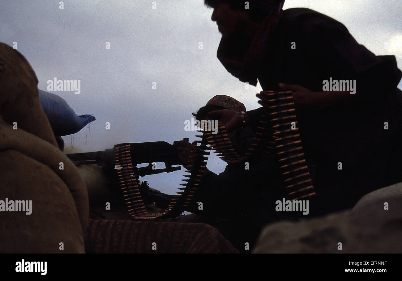 Government soldiers on the front line trenches open fire overlooking ...