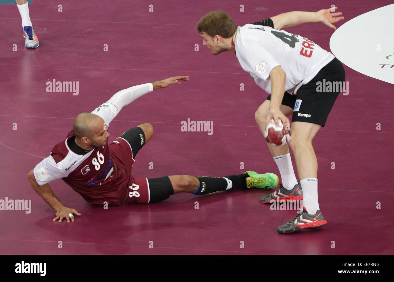 Germany's Paul Drux (R) and Mahmoud Hassab Alla of Qatar during the men ...