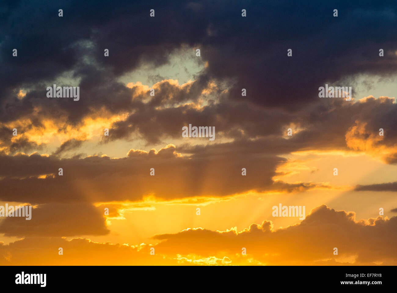 Sun rays through storm clouds hi-res stock photography and images - Alamy