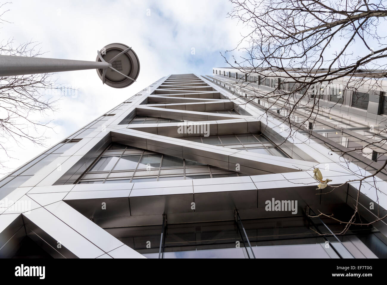 A view of a London building looking up towards the sky with lamp and ...