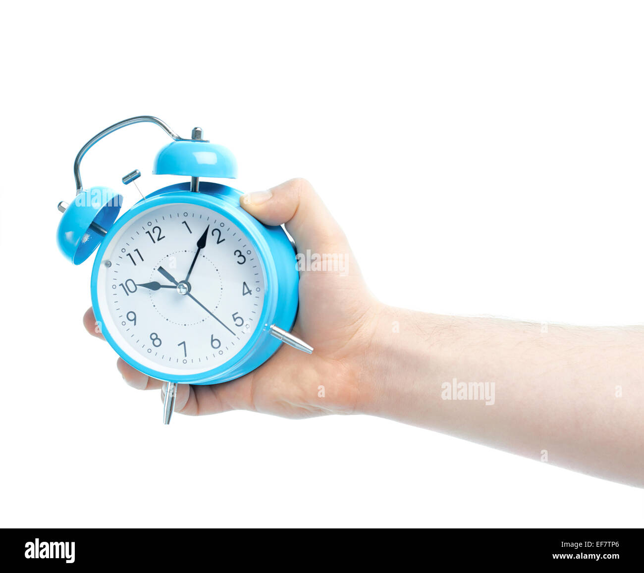Caucasian male hand holding alarm clock Stock Photo - Alamy