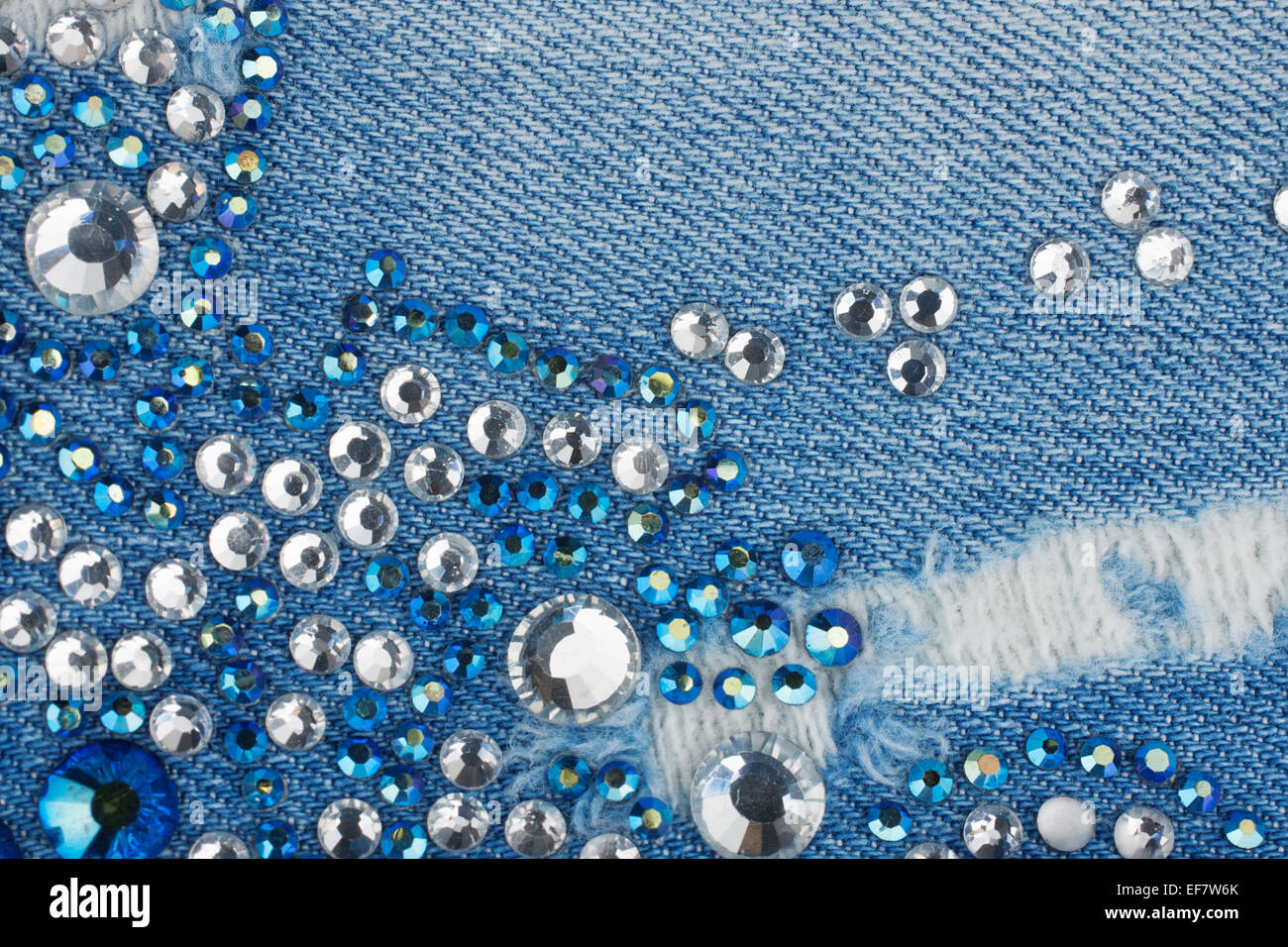 Light-blue denim with blue and silver rhinestones, background Stock ...