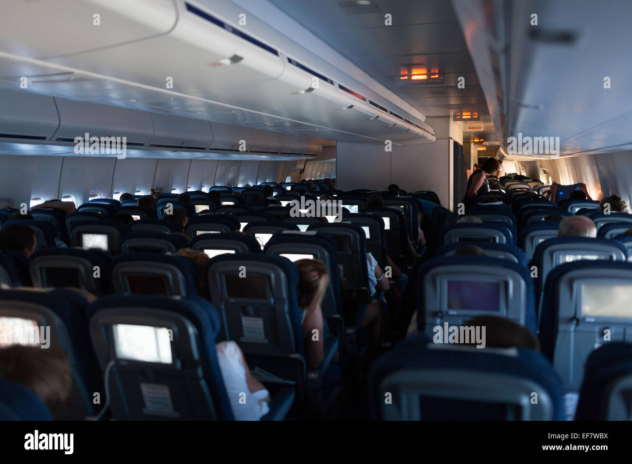 Cabin of modern passenger airplane Stock Photo - Alamy