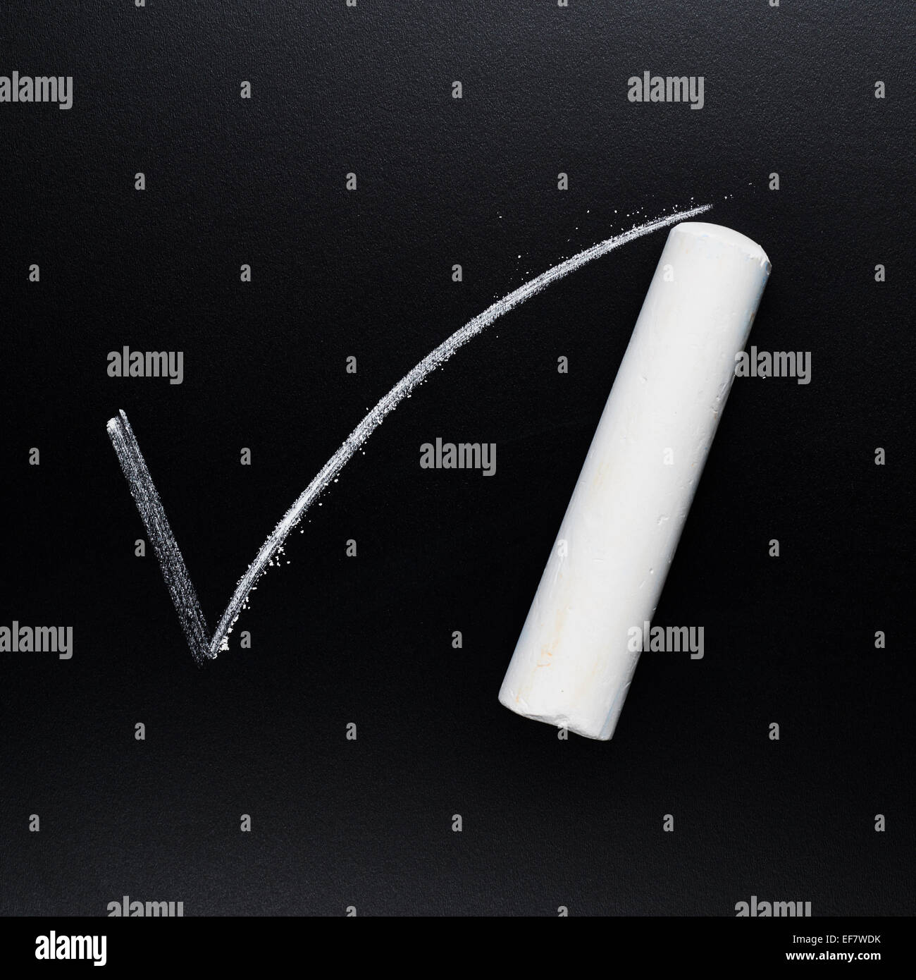 Drawn yes tick sign next to a piece of chalk Stock Photo - Alamy