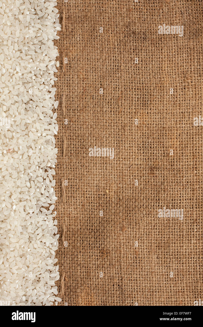 Rice lying on sackcloth can use as background Stock Photo - Alamy