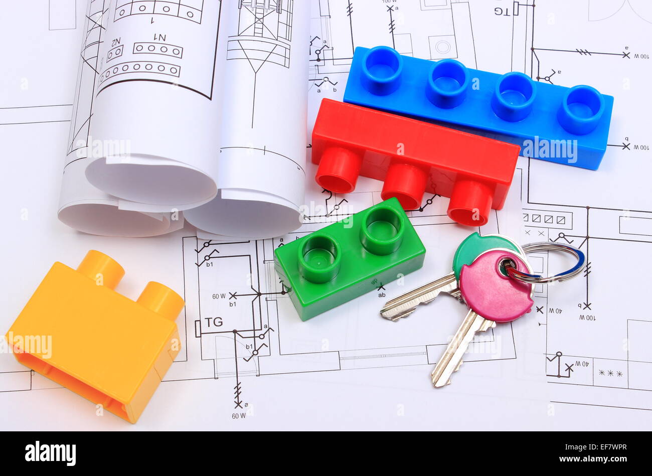 Home keys, plastic building blocks and electrical diagrams lying on ...