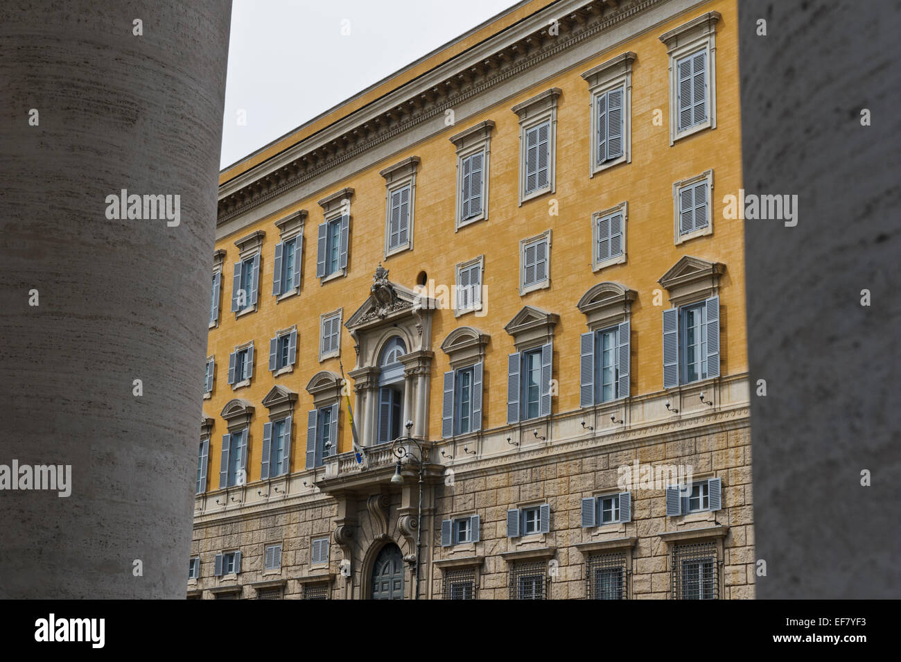 An facade of a office building behind the colonnade in Vatican City ...