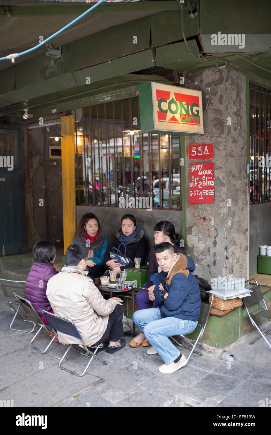 Group pf Friends sitting outside Cong Caphe Cafe Bar in Hanoi Vietnam ...