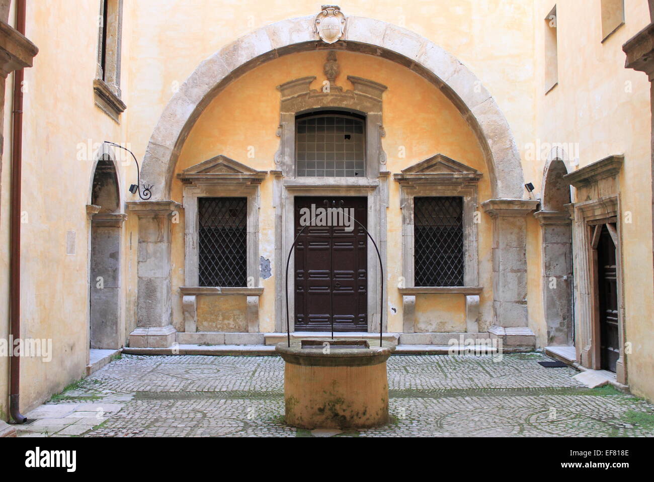 Medieval water well in a cloister Stock Photo - Alamy