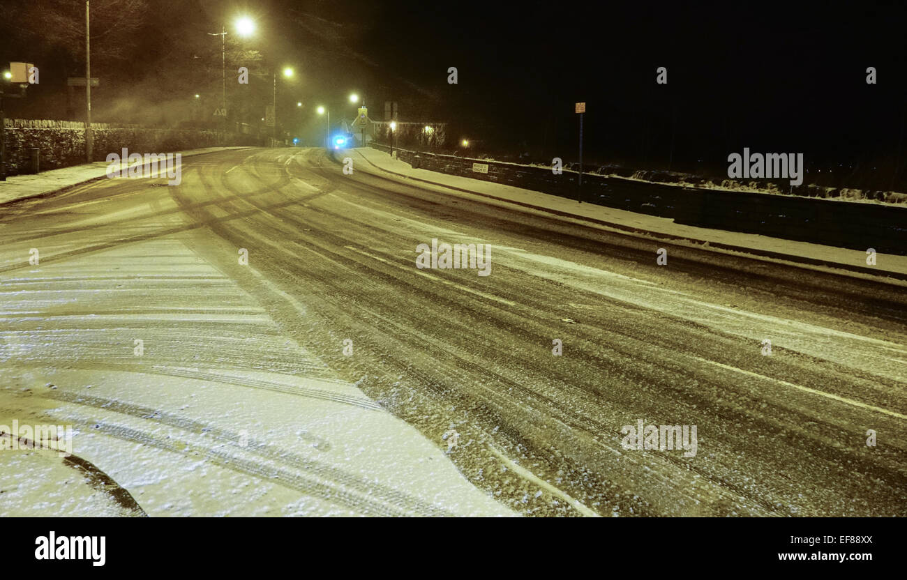 Blowing snow on roads in Queensbury, West Yorkshire at night Stock ...