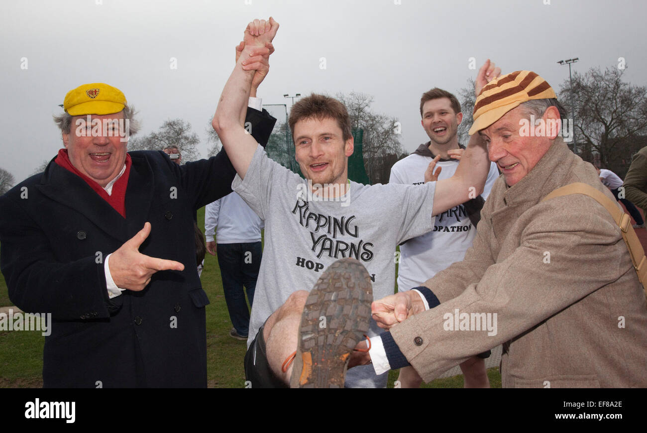L-R Terry Jones, Ben Lansley, winner of the 400m race and Michael Palin ...