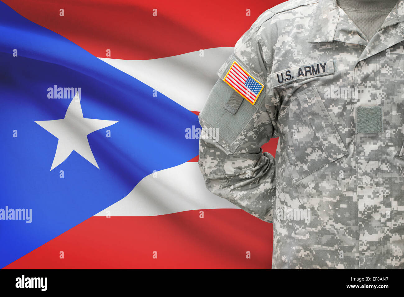 American soldier with flag on background - Puerto Rico Stock Photo - Alamy