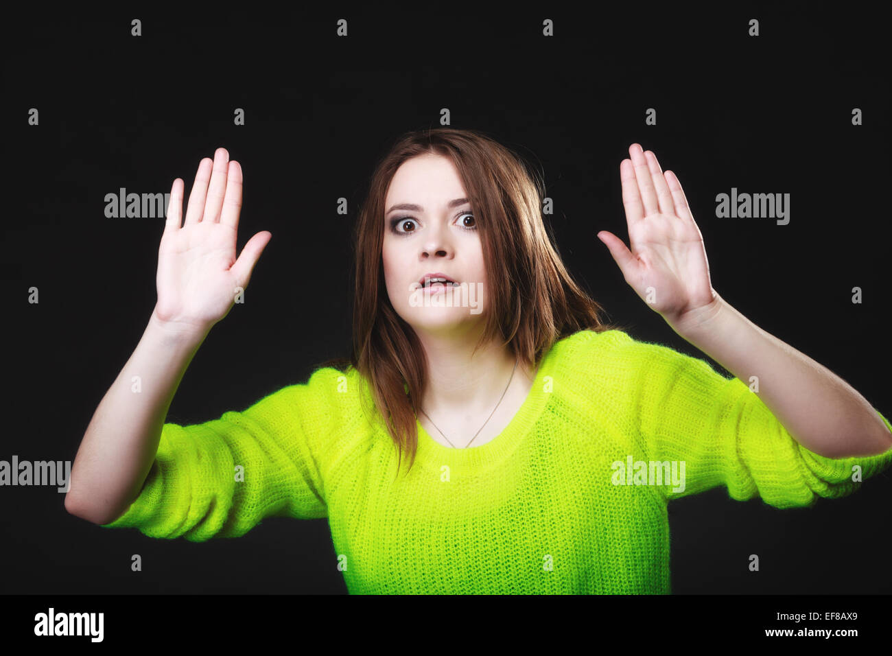 Scared. young woman teen girl making stop gesture sign with hands palms ...