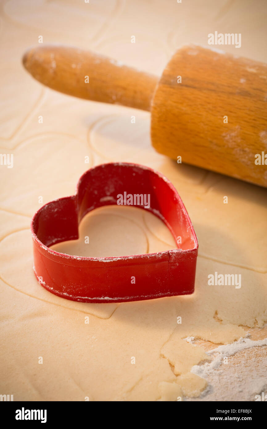 Heart shaped pastry cutter and rolling pin Stock Photo - Alamy