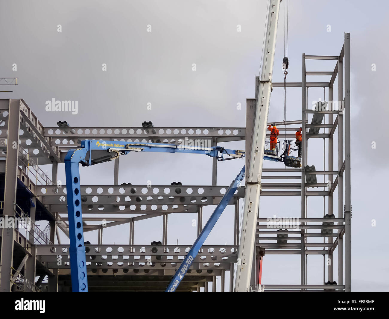 Construction Workers work at height, building the Ben Ainslie Racing ...