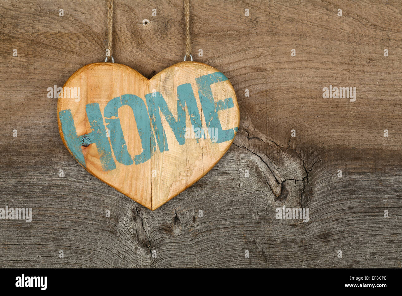Love Home message wooden heart sign from recycled old palette on rough ...