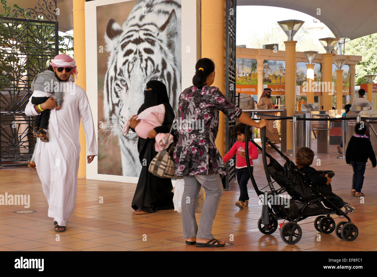 Arab family at entrance to Al-Ain Zoo, Abu Dhabi, United Arab Emirates ...