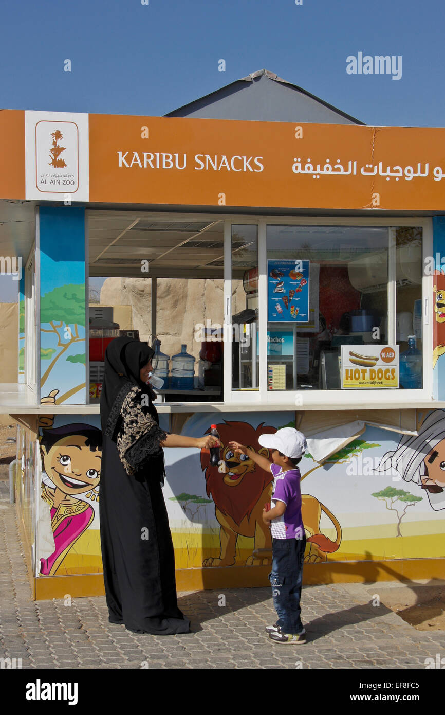 Mother and son at snack bar, Al-Ain Zoo, Abu Dhabi, United Arab ...