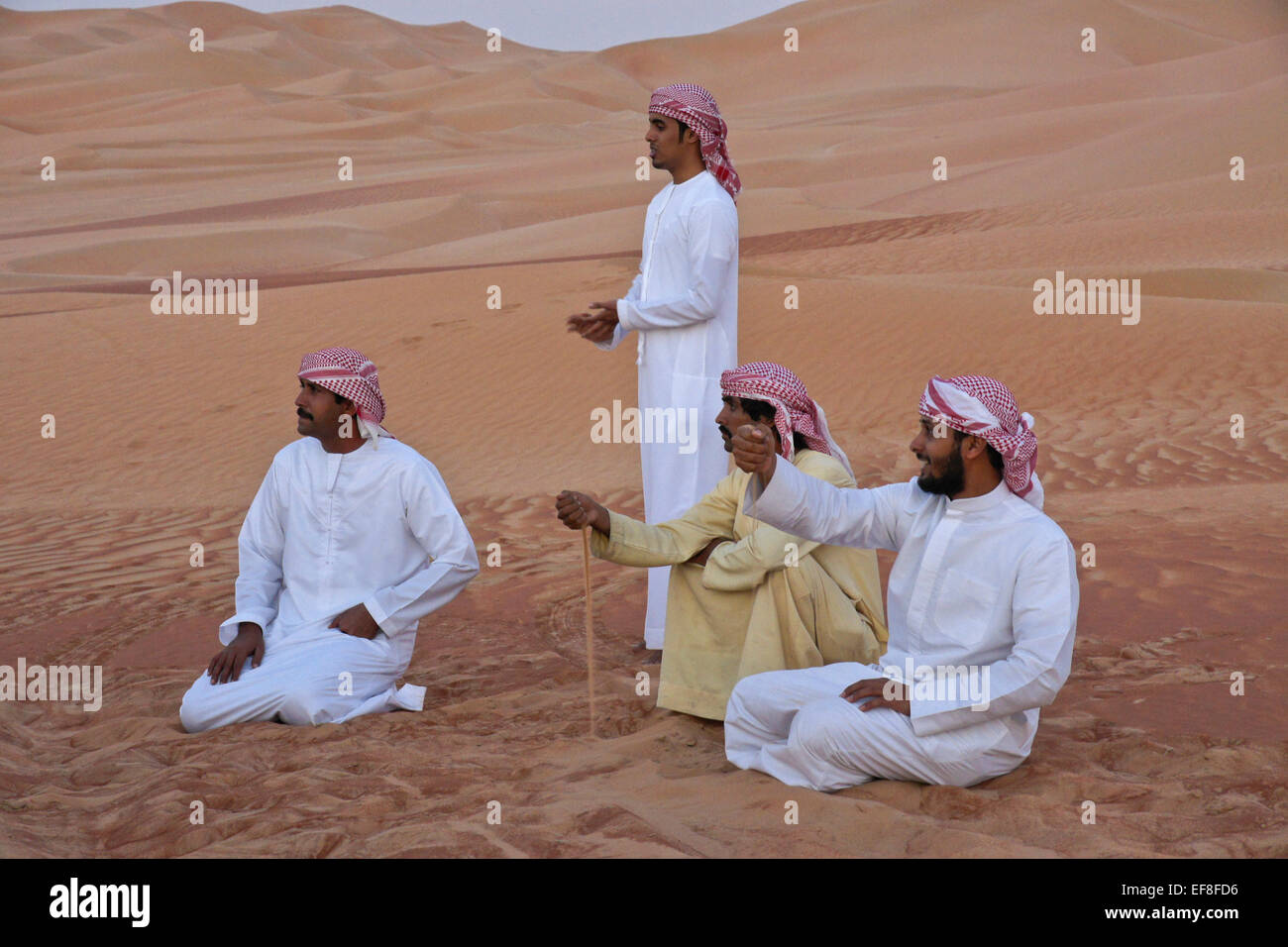 Arab men traditional dress sitting hi-res stock photography and images ...