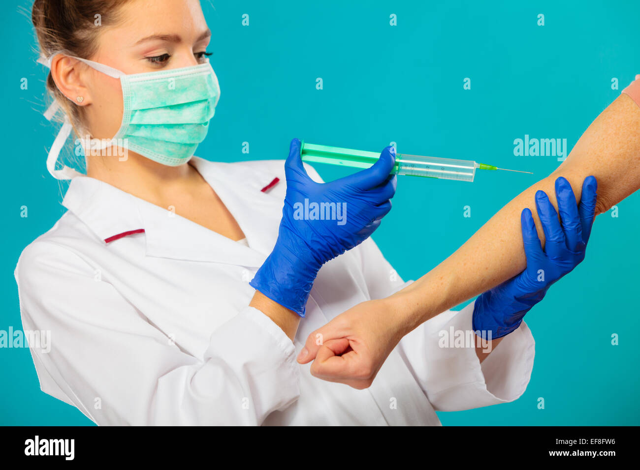 Doctor syringe girl patient hi-res stock photography and images - Alamy