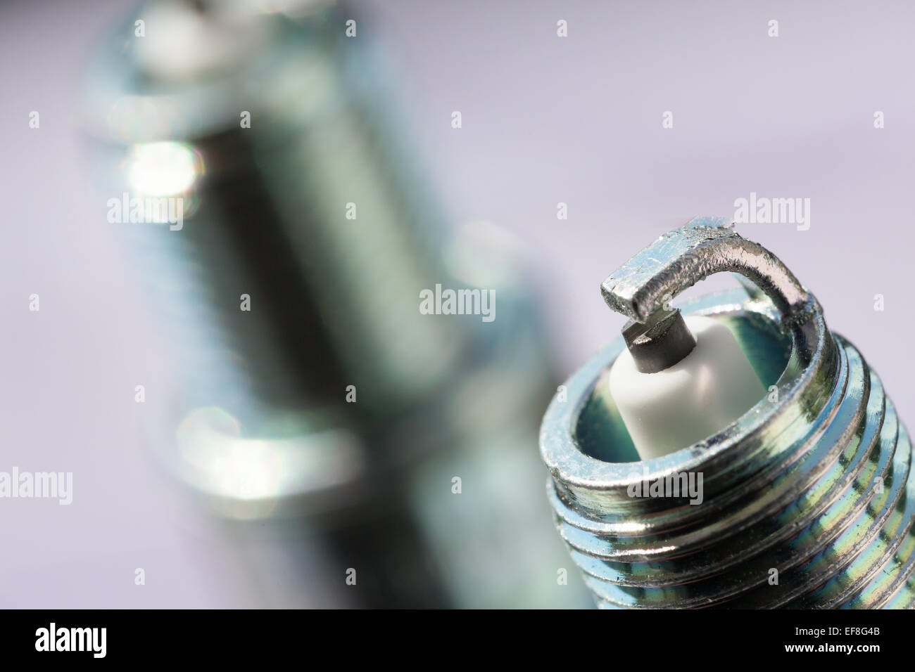 Auto service. Two new car spark plugs as spare part of auto ...