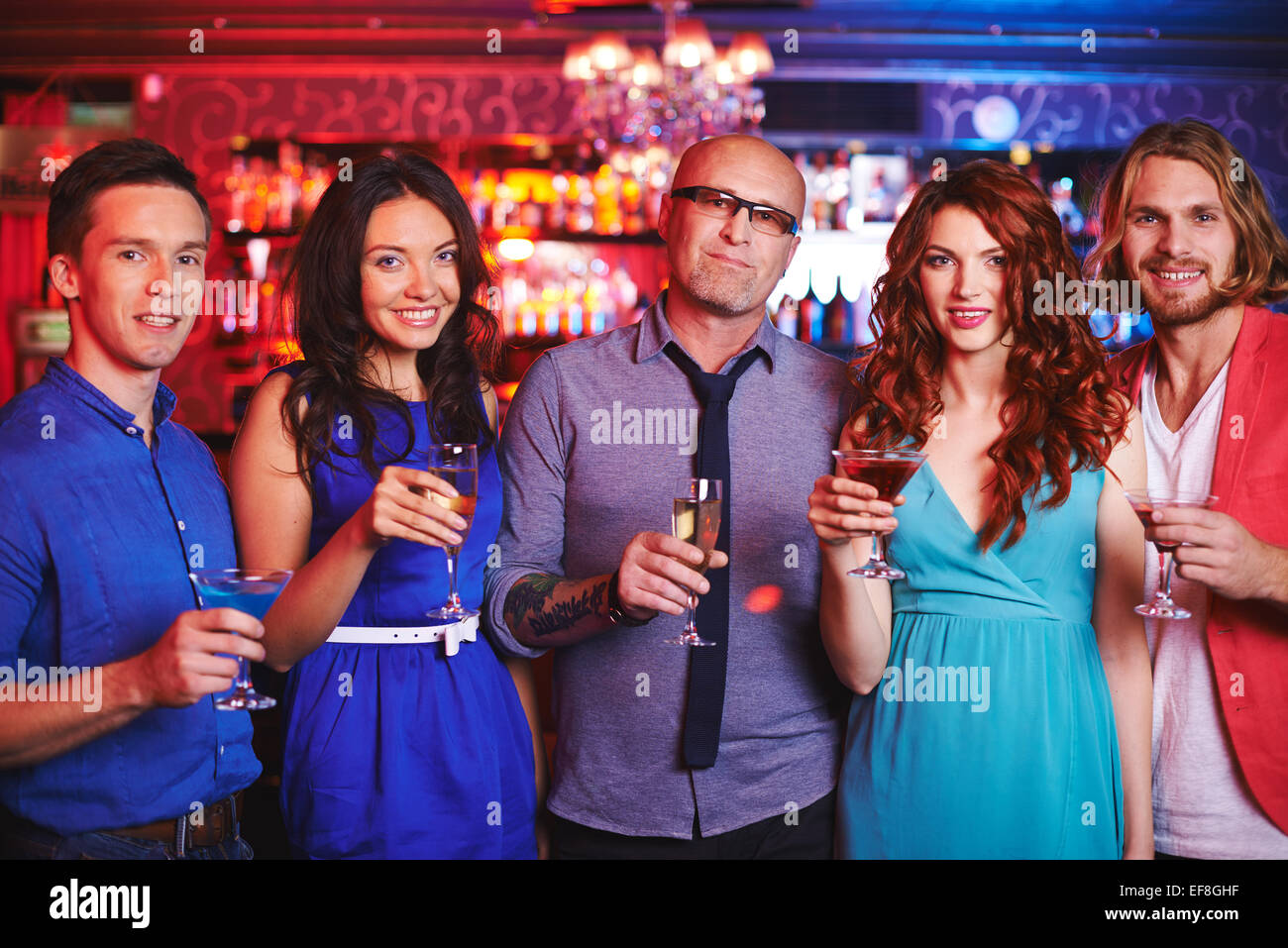 Group of boozing people with drinks having party in restaurant Stock ...