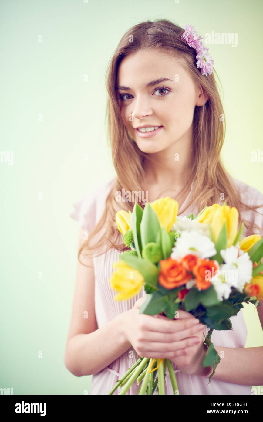 Fragile lady with spring flowers Stock Photo - Alamy