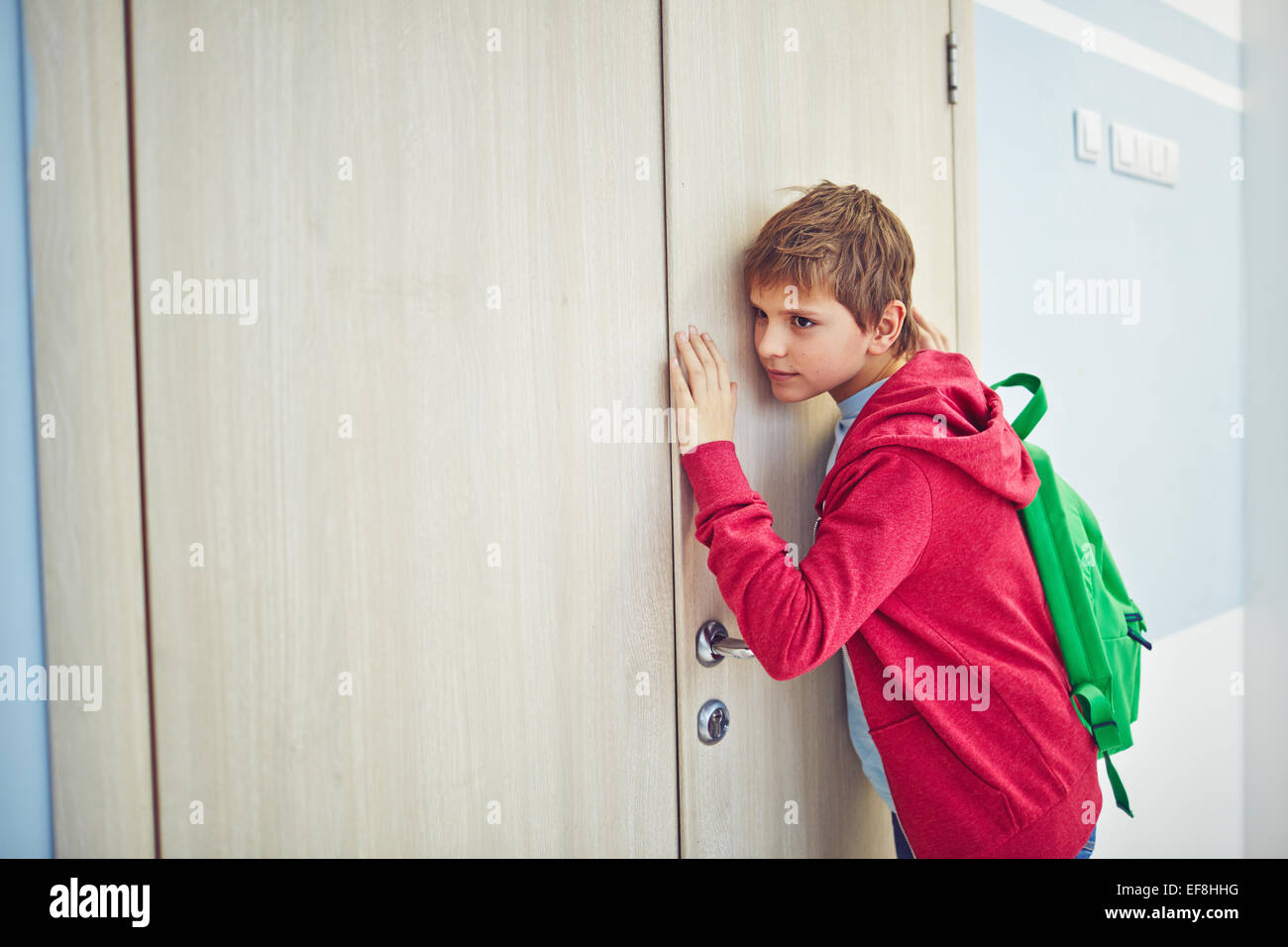 Eavesdropping at door hi-res stock photography and images - Alamy