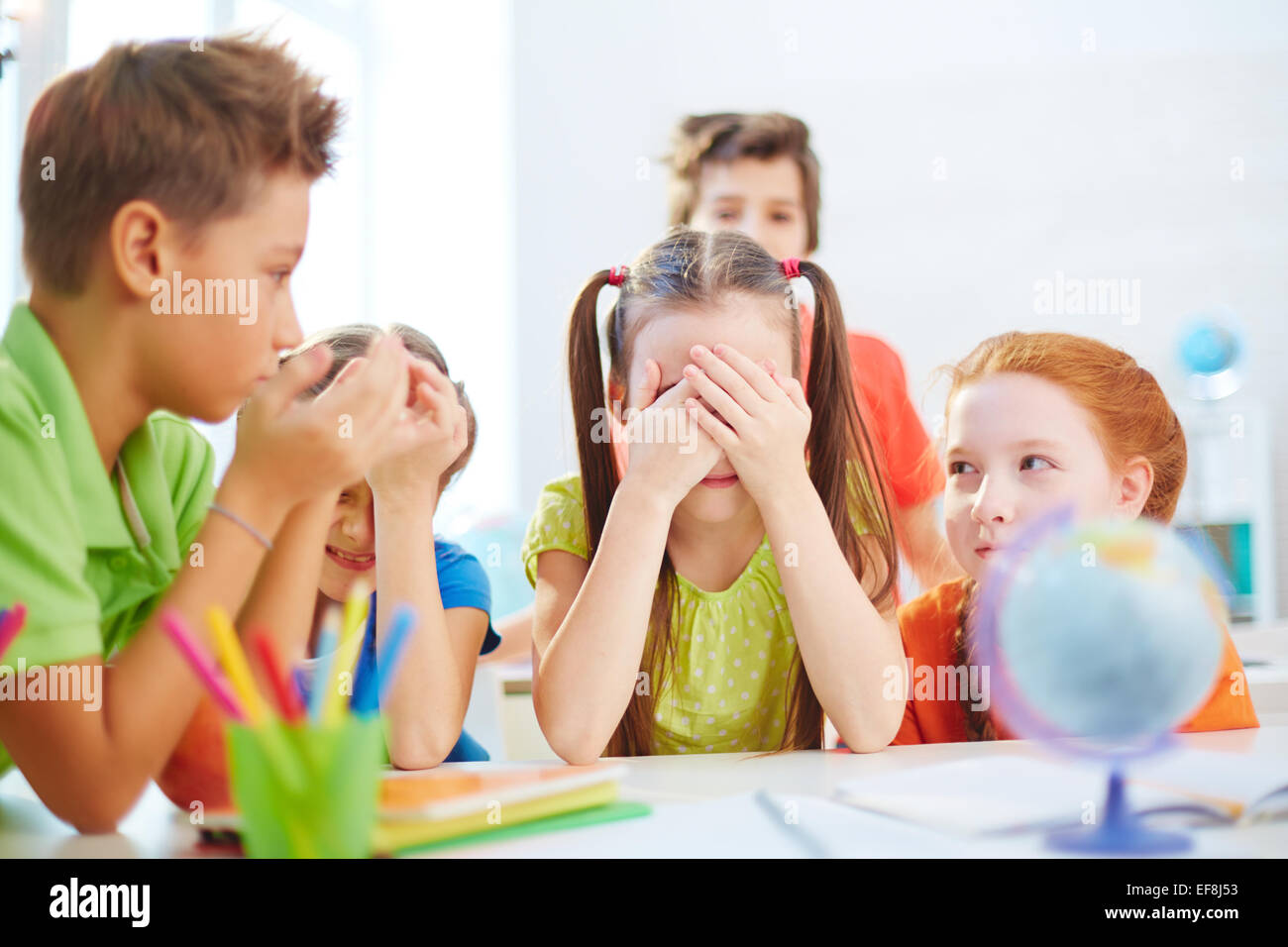Little friends playing during school break Stock Photo - Alamy