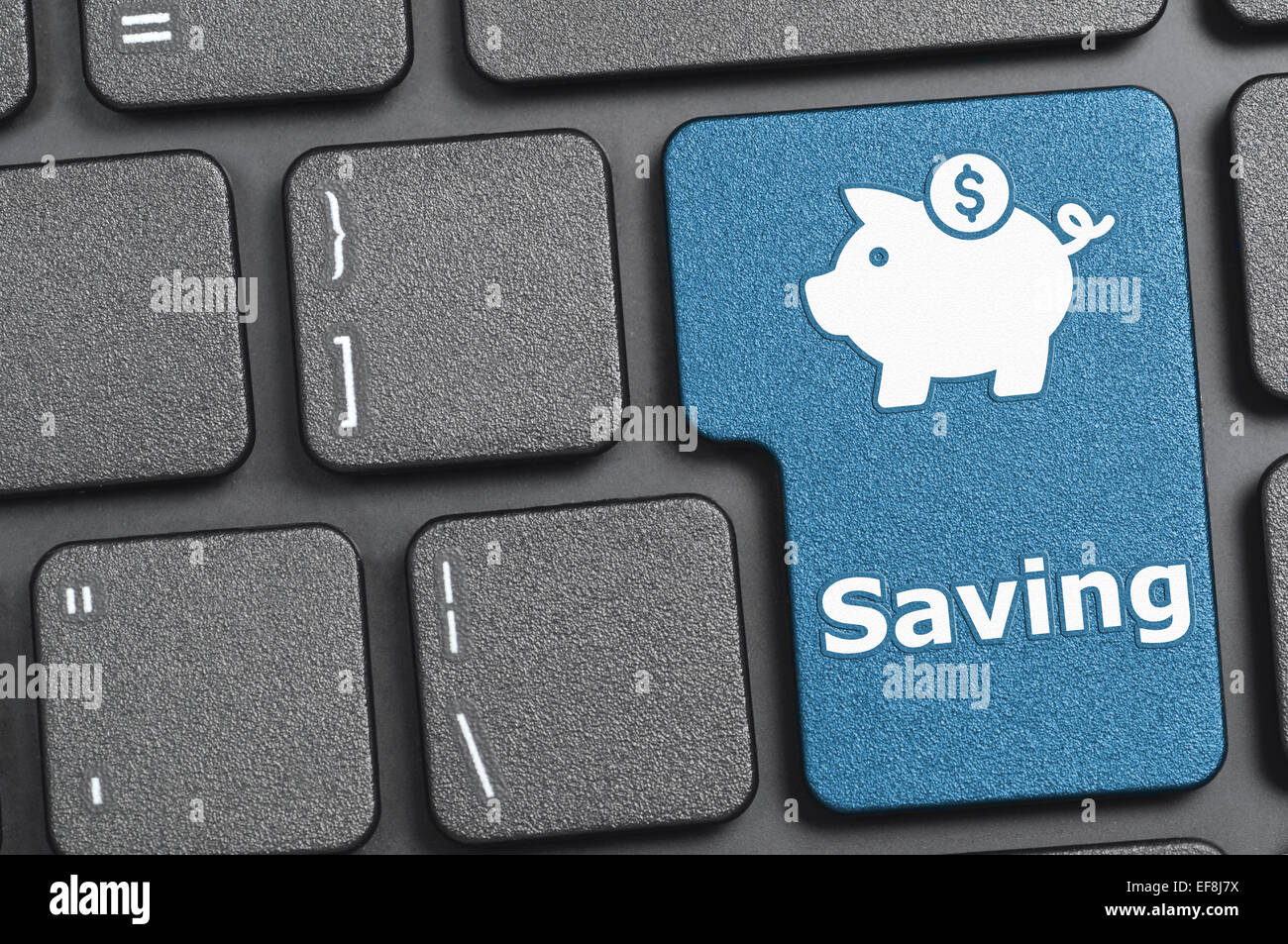 Blue saving concept key on keyboard Stock Photo - Alamy