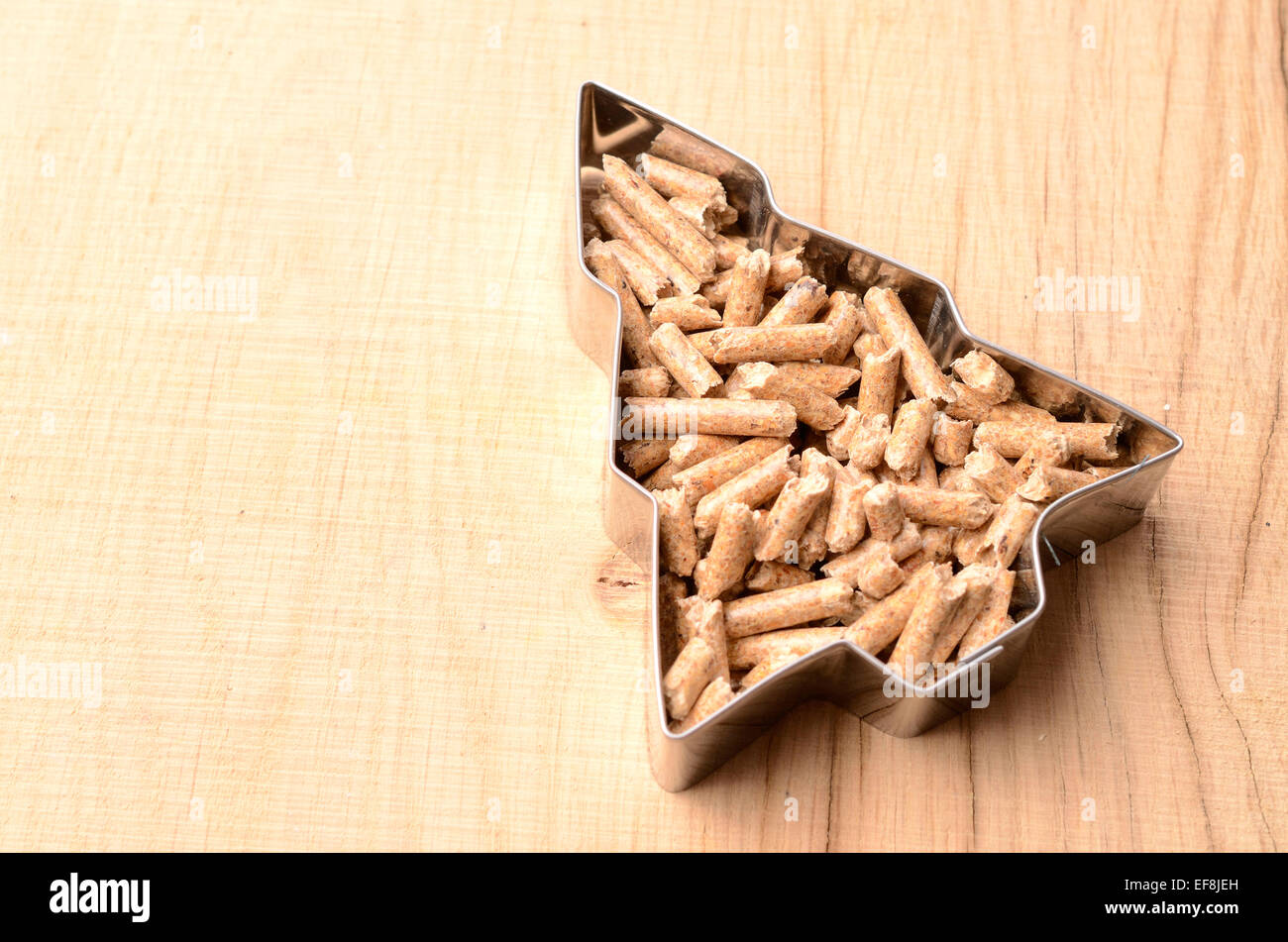 Wooden pellets in a tree shape with space for text or image Stock Photo ...