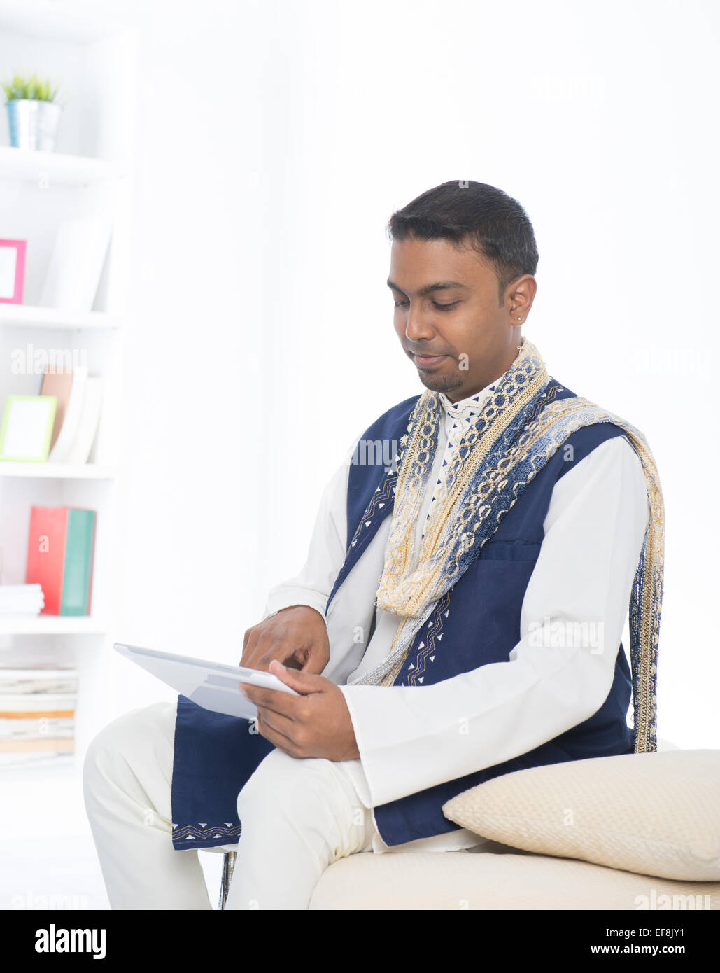 indian male with tradtional dresss and tablet computer Stock Photo - Alamy