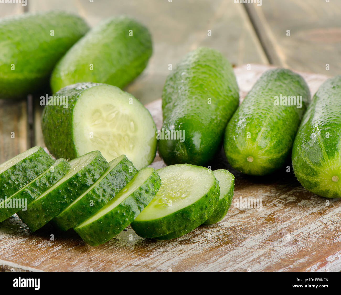 Fresh cucumbers on a wooden table. Selective focus Stock Photo - Alamy