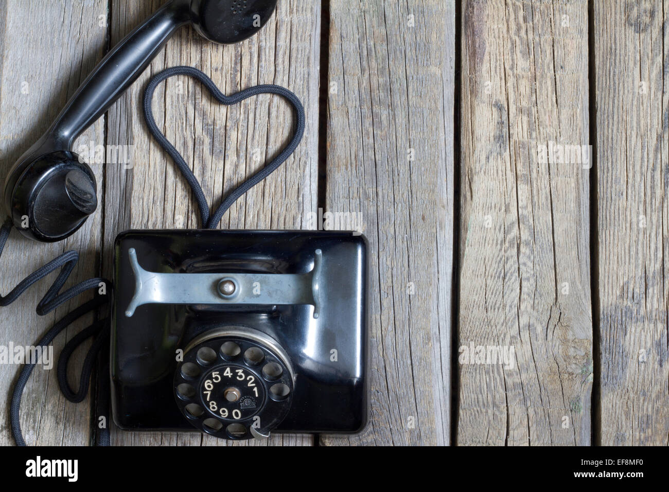 Old retro telephone with heart shape abstract concept Stock Photo - Alamy