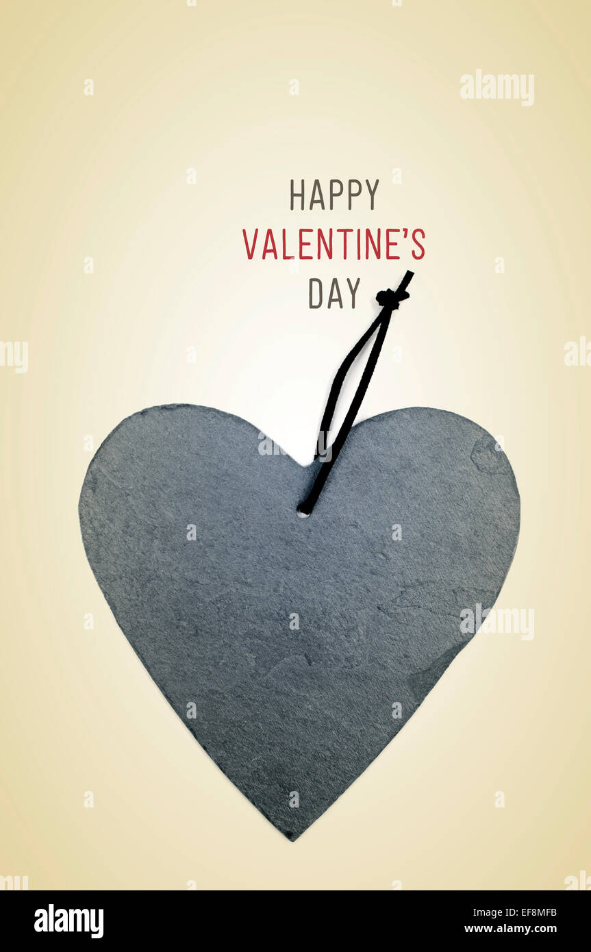 a piece of slate stone in the shape of a heart and the text happy ...