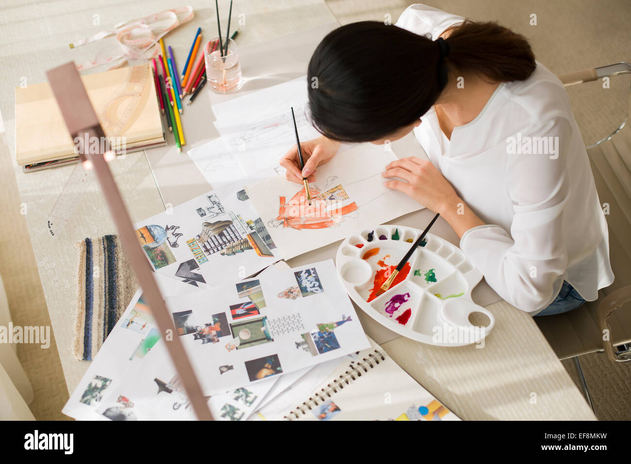 Fashion designer drawing sketch Stock Photo - Alamy