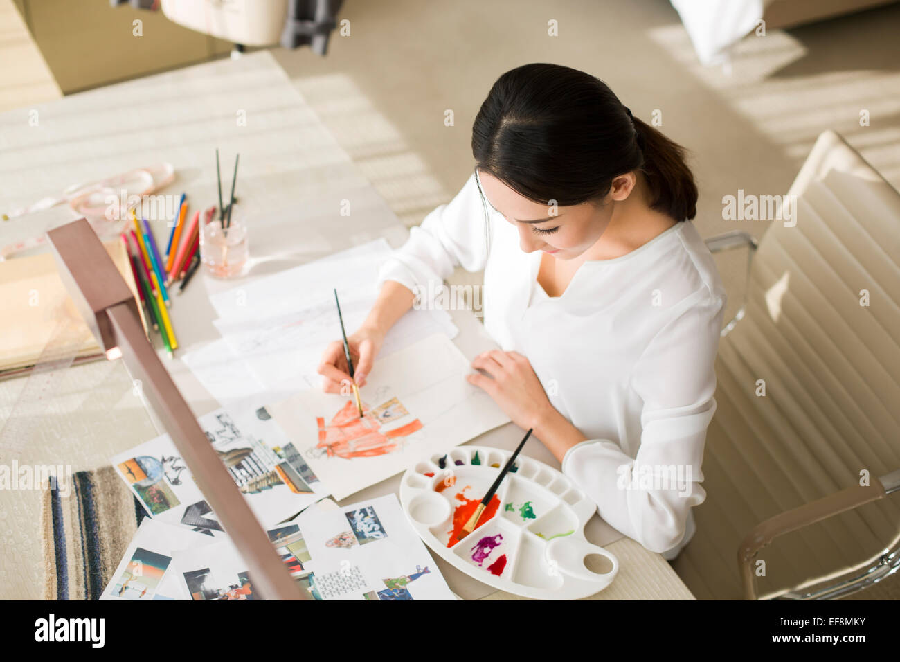 Fashion designer drawing sketch Stock Photo - Alamy