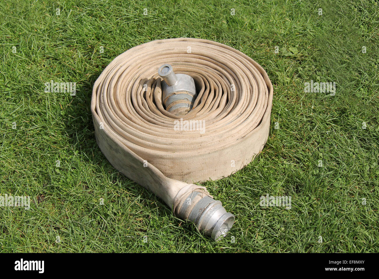 A Vintage Cloth Made Coiled Fire Hose Stock Photo - Alamy