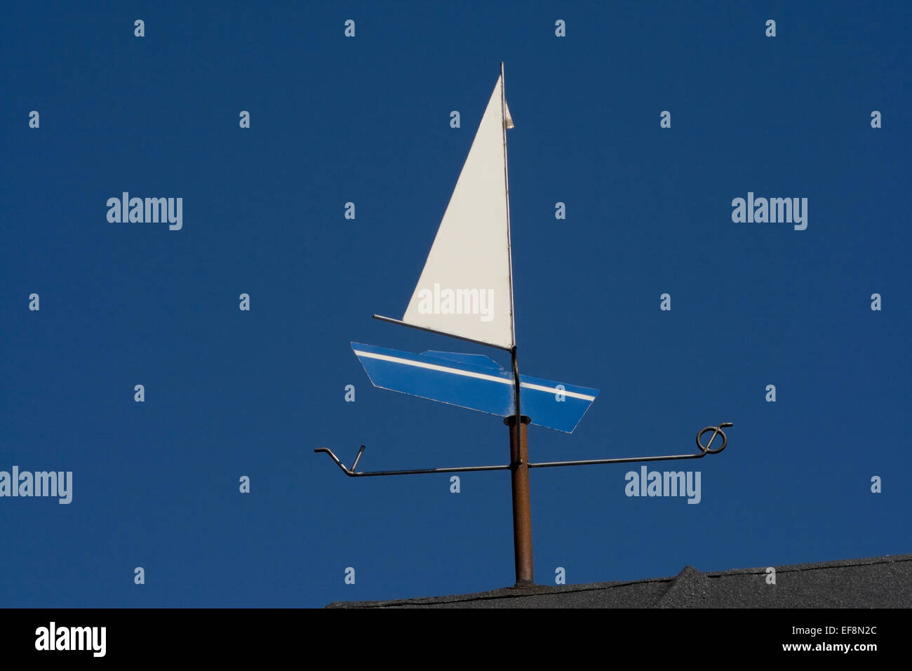 Weather vane - Blue boat - against the blue sky Stock Photo - Alamy