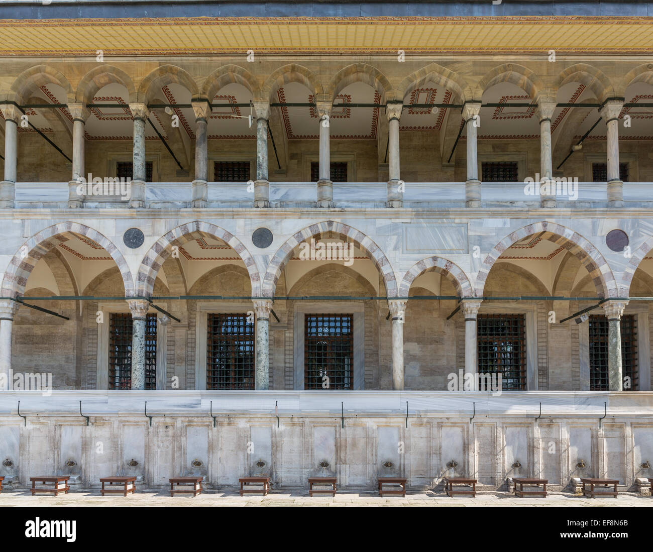 Front view of corridor and fountains for ritual ablution Stock Photo ...