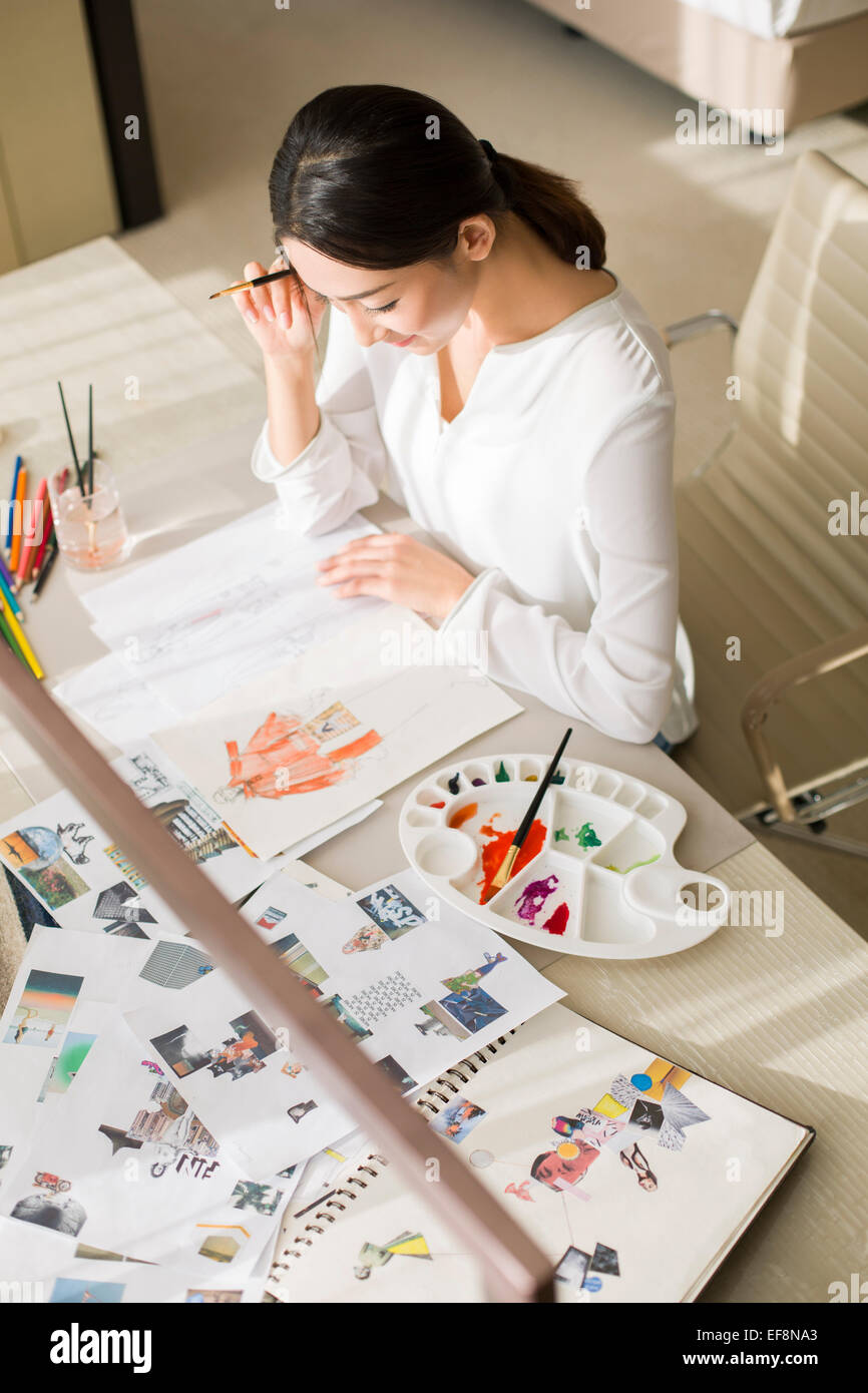 Fashion designer drawing sketch Stock Photo - Alamy