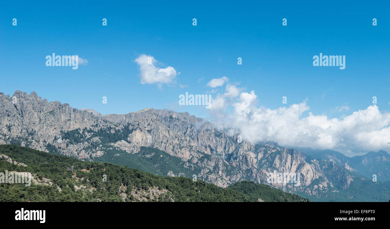 Cliffs and rocks in front of clouds, Col de Bavella Bavella Massif ...